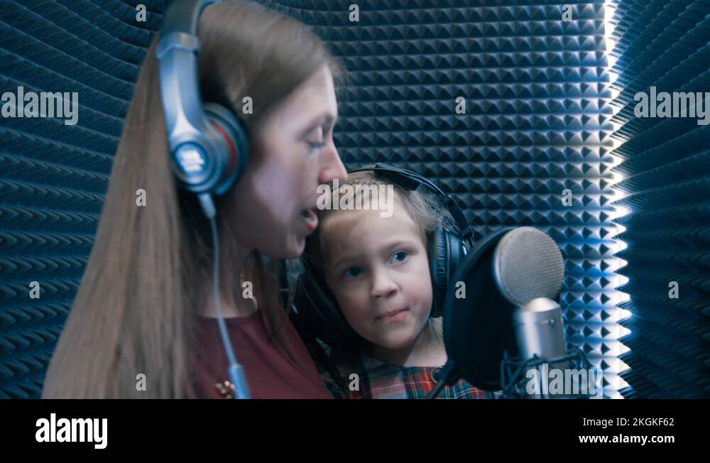 mother and daughter together record their voices in the recording ...