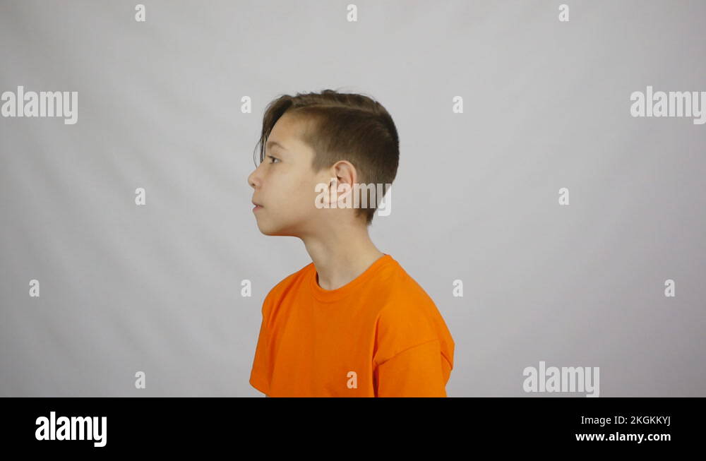 young handsome young man with long hair, shaking his head, straightens ...