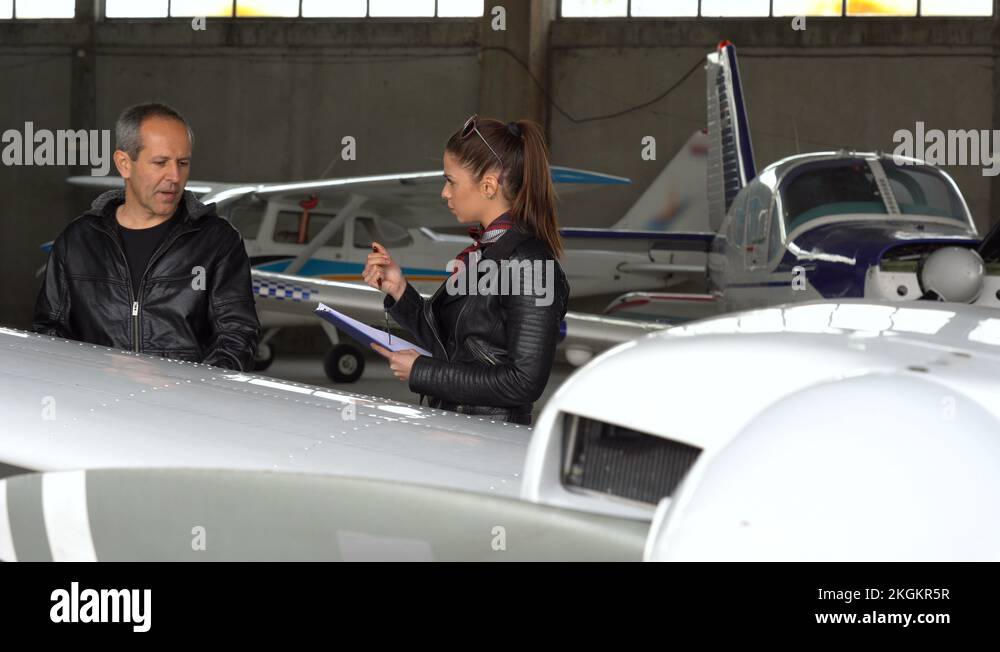 Flight Instructor and Student Pilot Doing the Visual Inspection on an ...