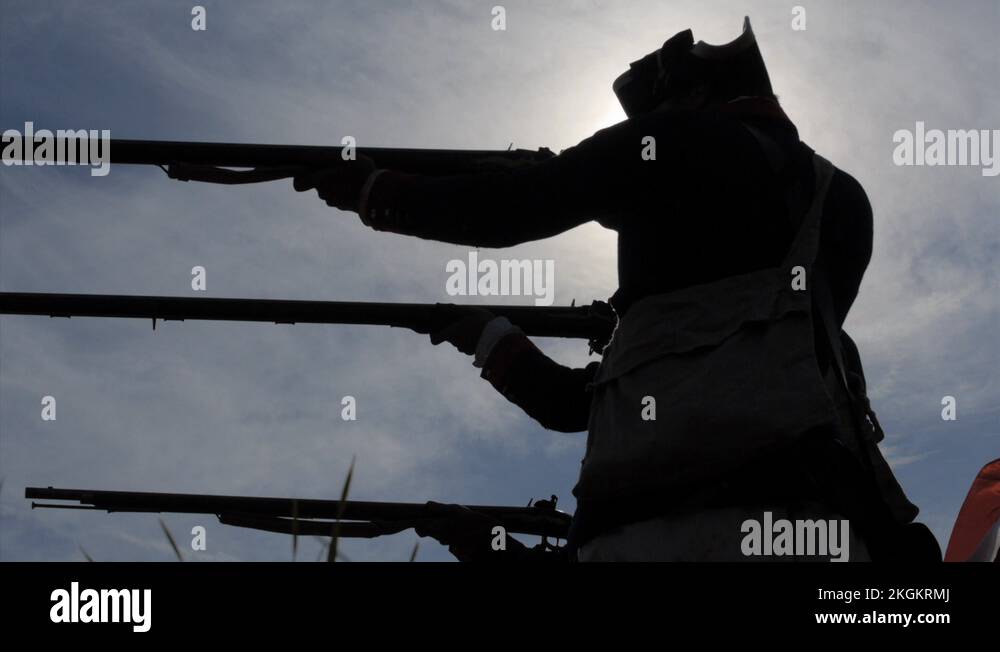 18th century Soldiesr fires Brown Bess Flintlock Muskets with black ...