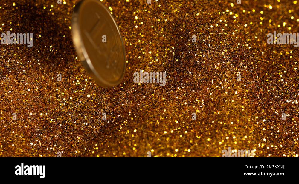Coin of 1 Euro Rolling on Gold Powder against Black Background, Slow ...
