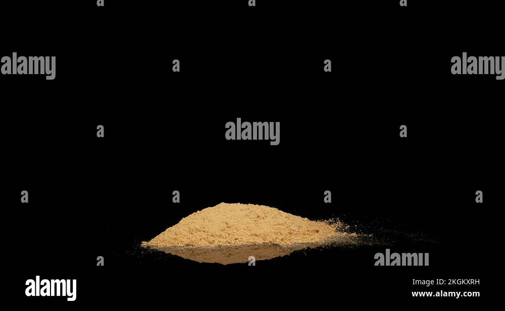 Ginger, Zingiber officinale, Powder against Black Background, Slow ...