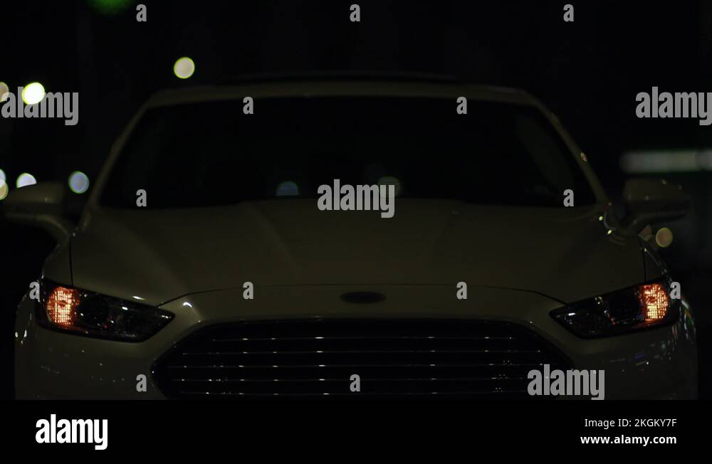 Close up view of blinking turn lights signals of luxurious modern white ...