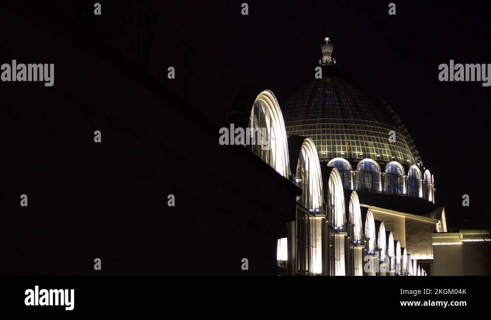 Facade of a nice building. Windows and the dome are beautifully lit ...