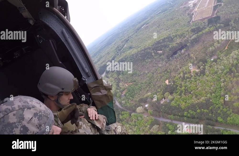 Jumpmaster gives one minute warning to paratroopers aboard UH-60 Black ...
