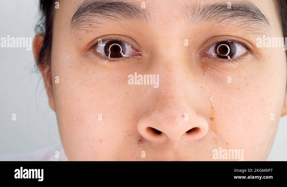 Shot of Asian young woman crying with tear and angry eyes on white ...