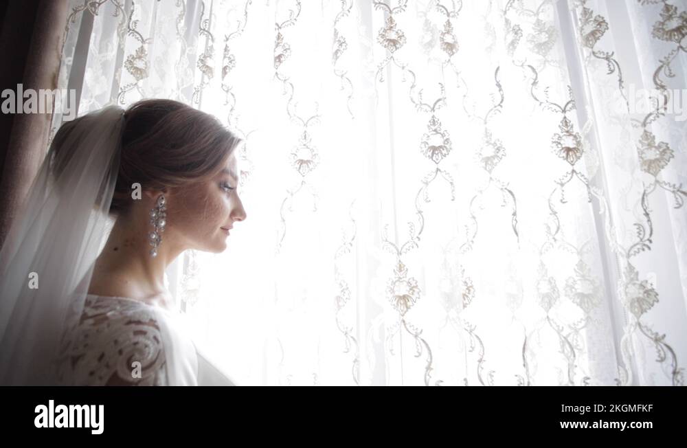 Elegant bride walkin though the room in her wedding day, She waiting ...