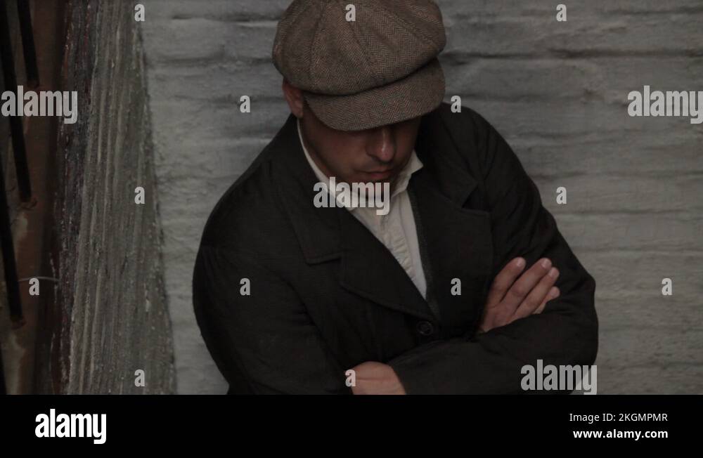 Portrayal of Gangster/Mobster waiting in a back-alley for a shake-down ...