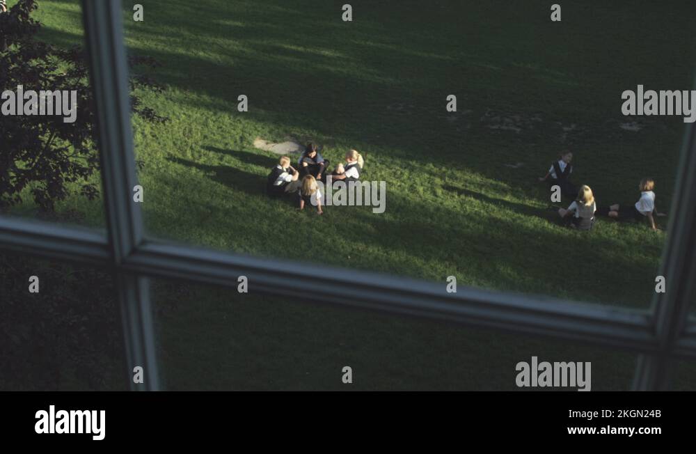 WS, View through a window of children in a schoolyard Stock Video ...