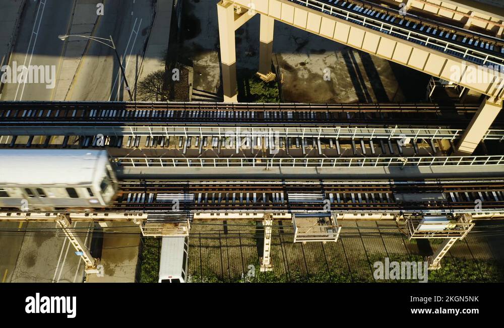 Birds Eye View of CTA Training Passing Over Tracks [4K] Stock Video ...