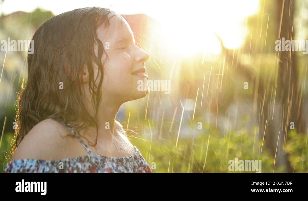 Kids Play in Summer Rain. Child Playing Outdoor On Rainy Day. Little ...