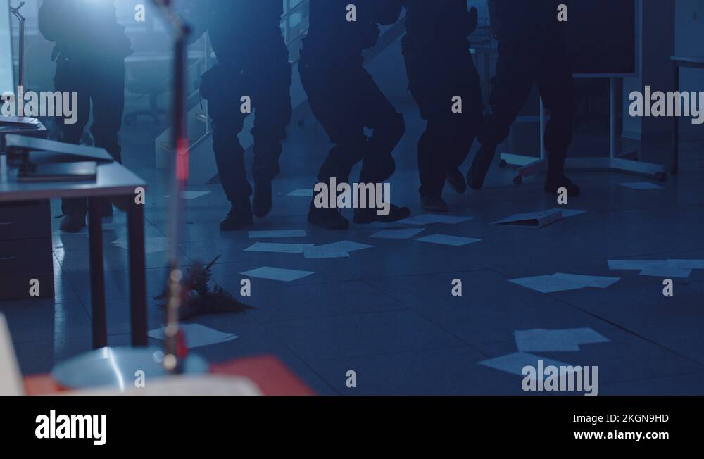 Masked Squad of Armed SWAT Police Officers Slowly Move in a Hall of an ...
