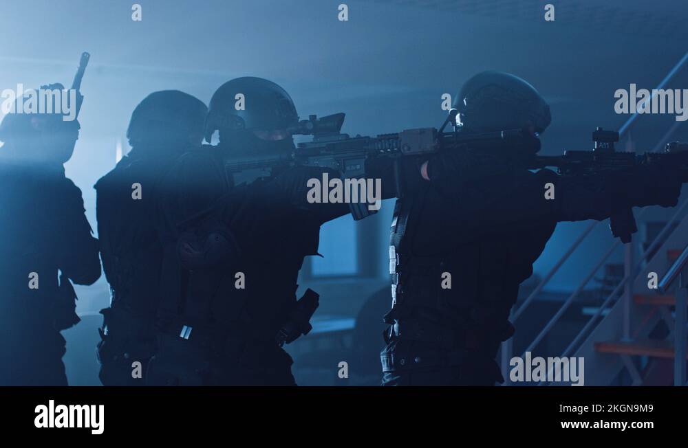 Close Up Portraits of Masked Squad of Armed SWAT Police Officers Storm ...