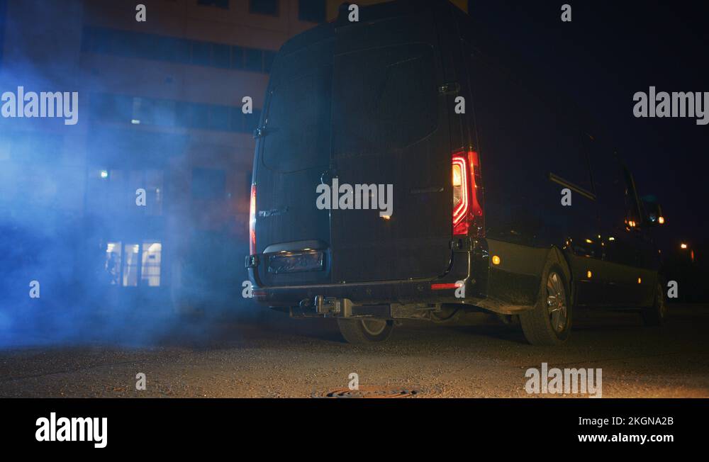 Masked Team of Armed SWAT Police Officers Exit a Black Van Parked ...