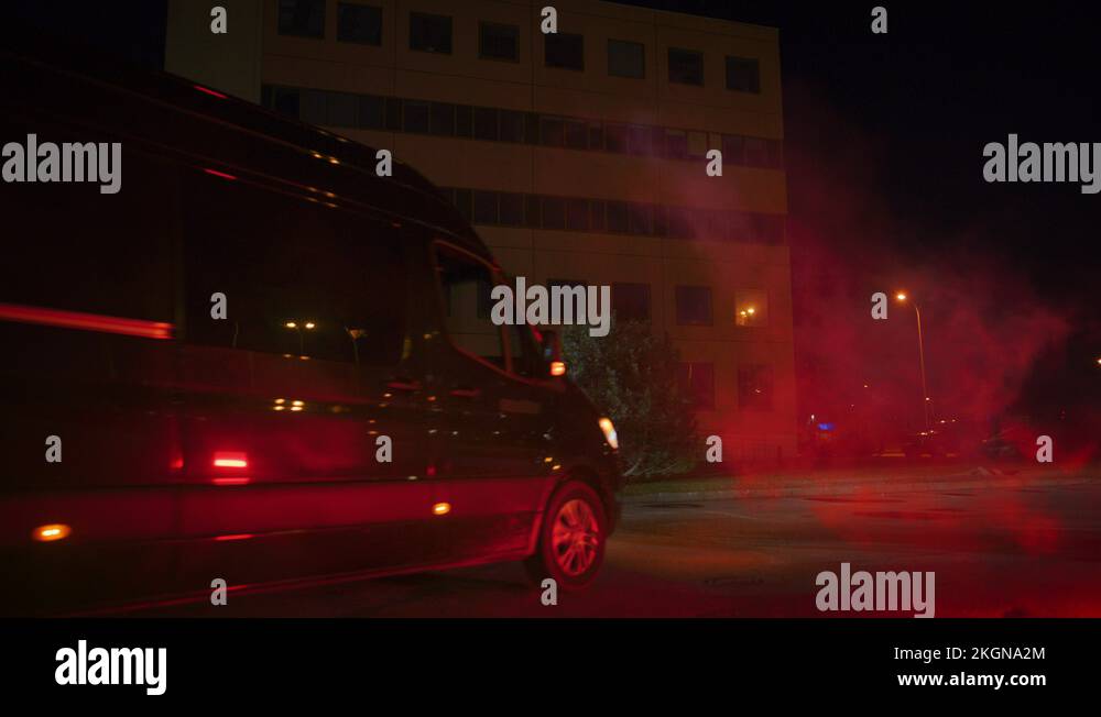 Masked Team of Armed SWAT Police Officers Exit a Black Van Parked ...