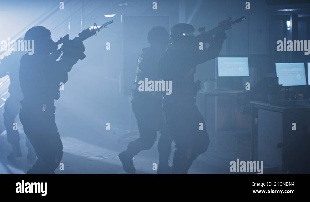 Masked Team of Armed SWAT Police Officers Slowly Move in a Hall of a ...