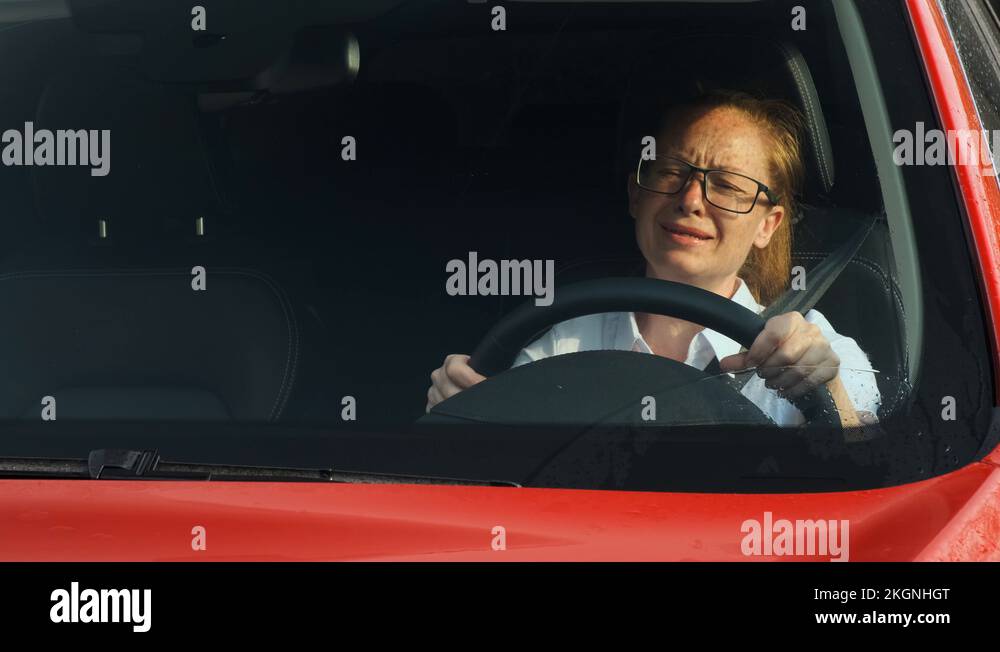 Upset businesswoman crying while driving a car Stock Video Footage - Alamy