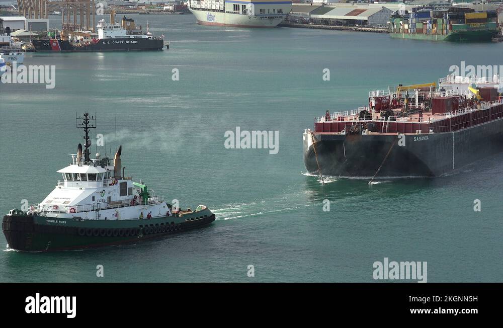 A tug guides Sasanoa tank barge ship, Honolulu, Hawaii, USA Stock Video ...