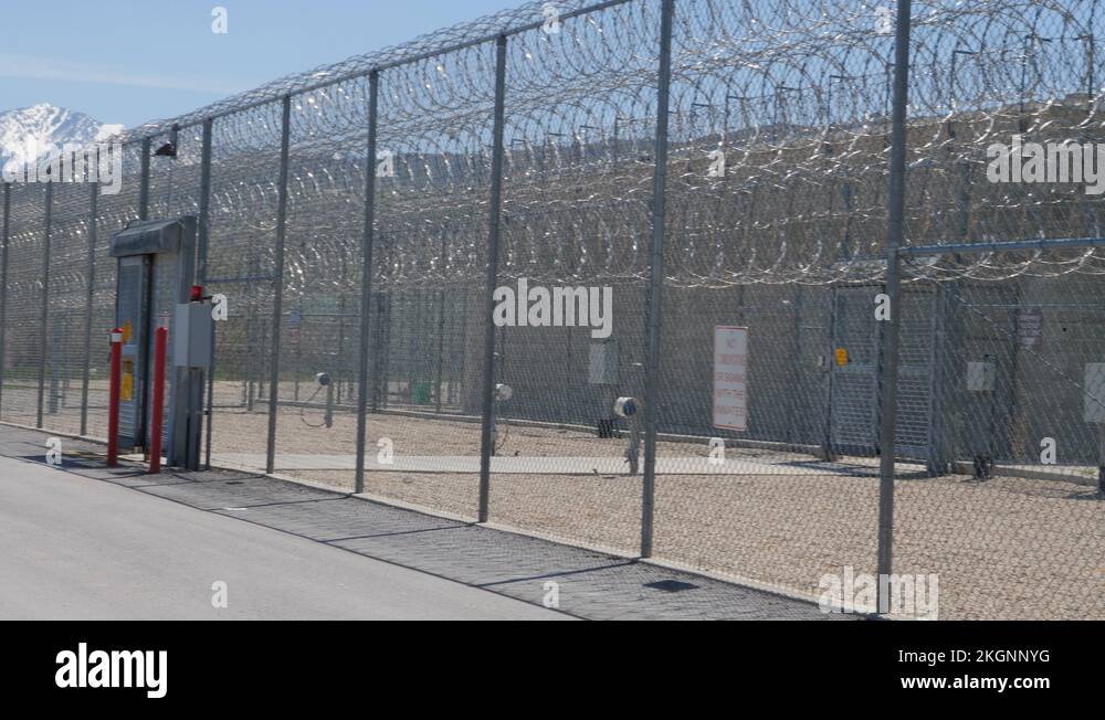 Prison front gate with lots or barbed wire Stock Video Footage - Alamy