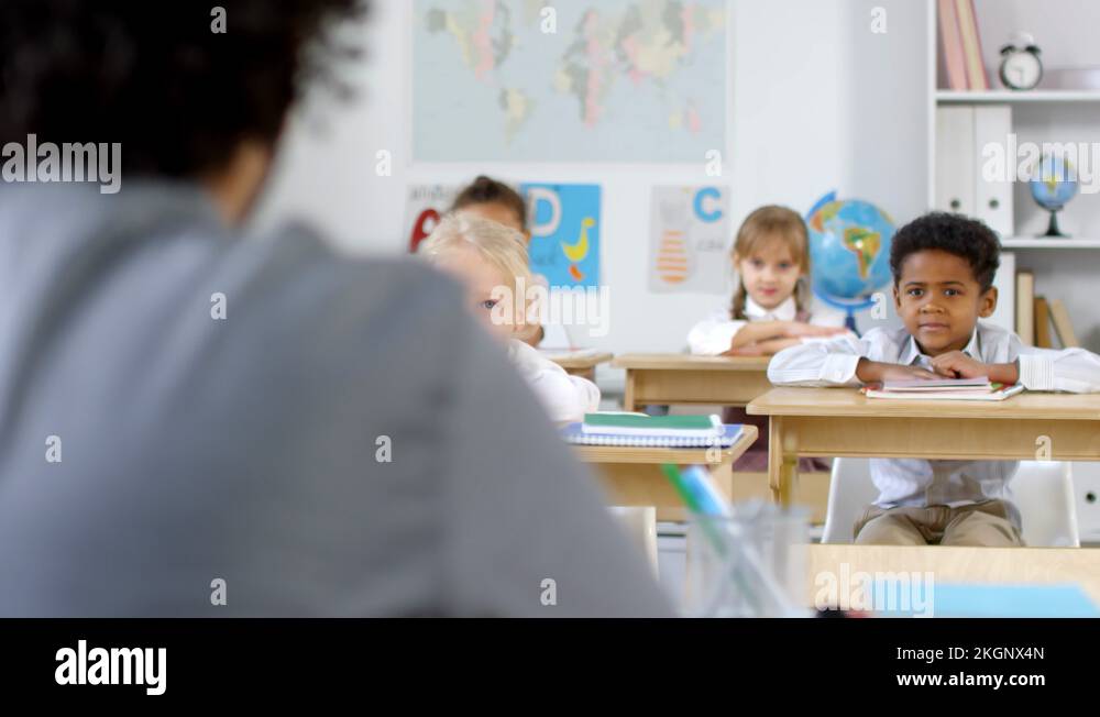 Primary School Children Raising Hands in Classroom Stock Video Footage ...