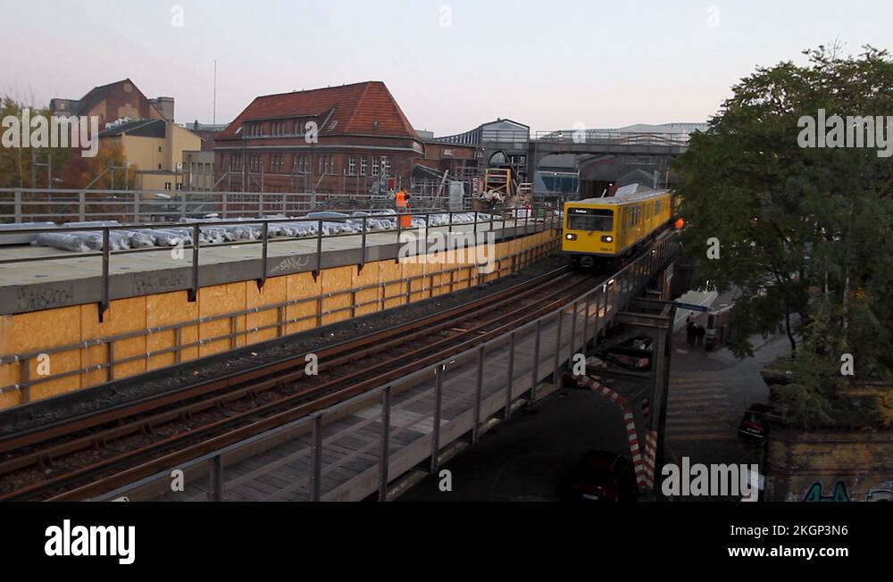 The yellow subway train passes through the viaduct Stock Video Footage ...