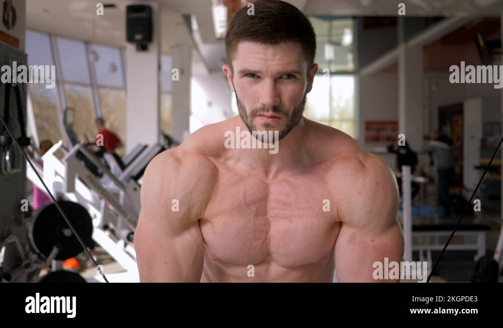 power training, muscular bodybuilder male doing strength exercises on ...