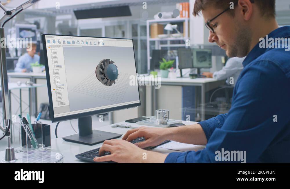 Engineer Working on Desktop Computer, Screen Showing CAD Software with 3D Engine Stock Video ...
