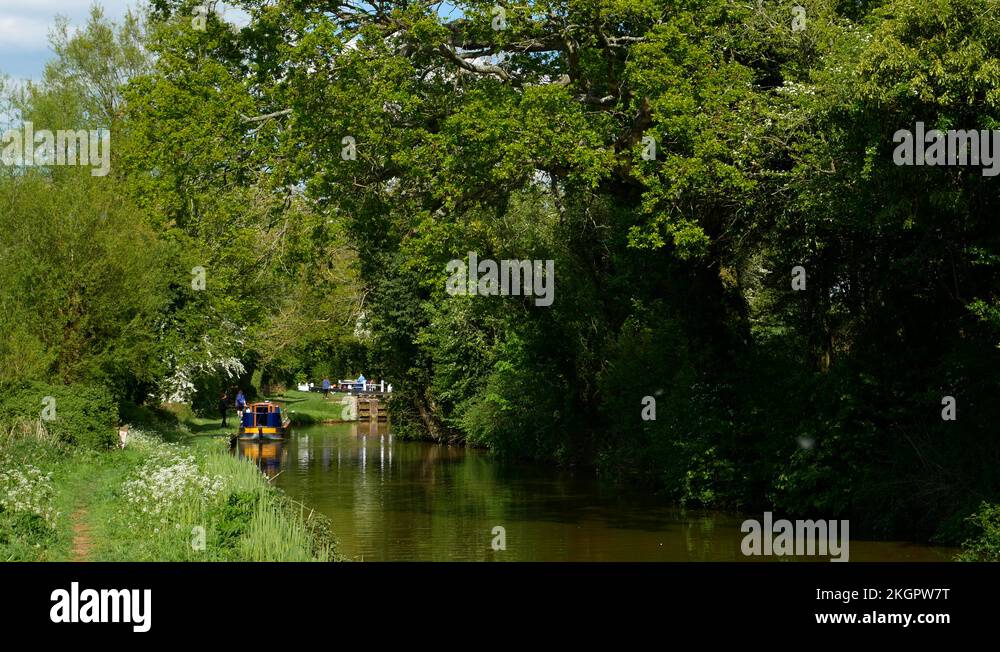 idyllic scene on the Oxford canal a distant lock and narrowboat Stock ...