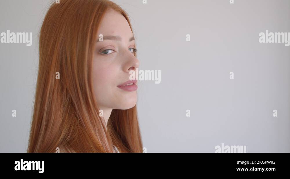 Profile Portrait Of Beautiful Ginger Model Watching With Happy And