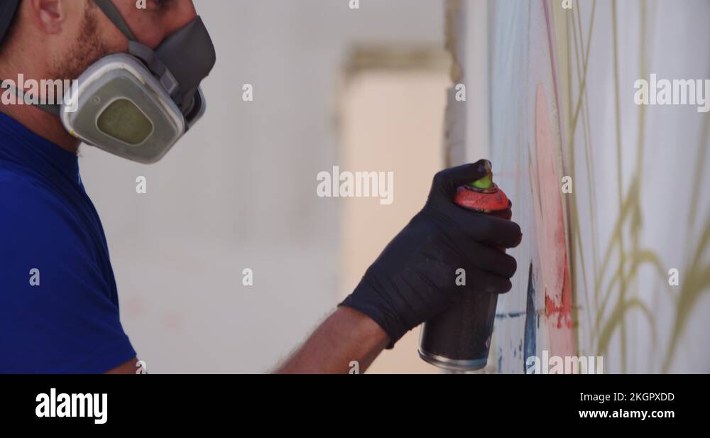 Graffiti artist painting with aerosol spray 4k Stock Video Footage - Alamy