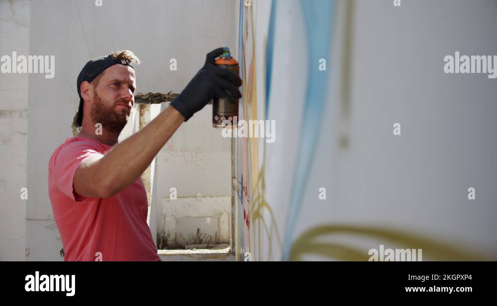 Graffiti artist painting with aerosol spray 4k Stock Video Footage - Alamy