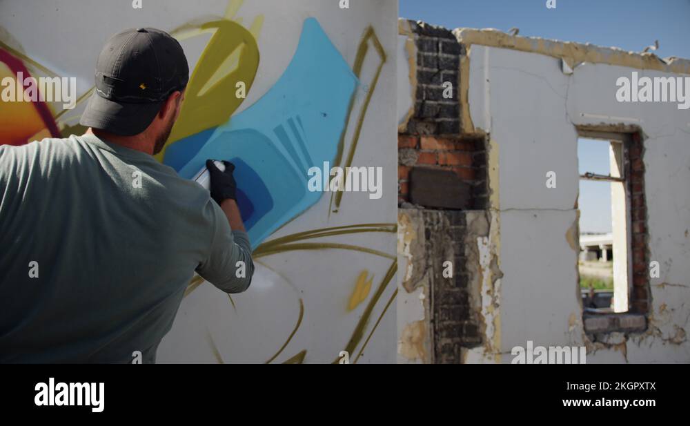 Graffiti artist painting with aerosol spray 4k Stock Video Footage - Alamy