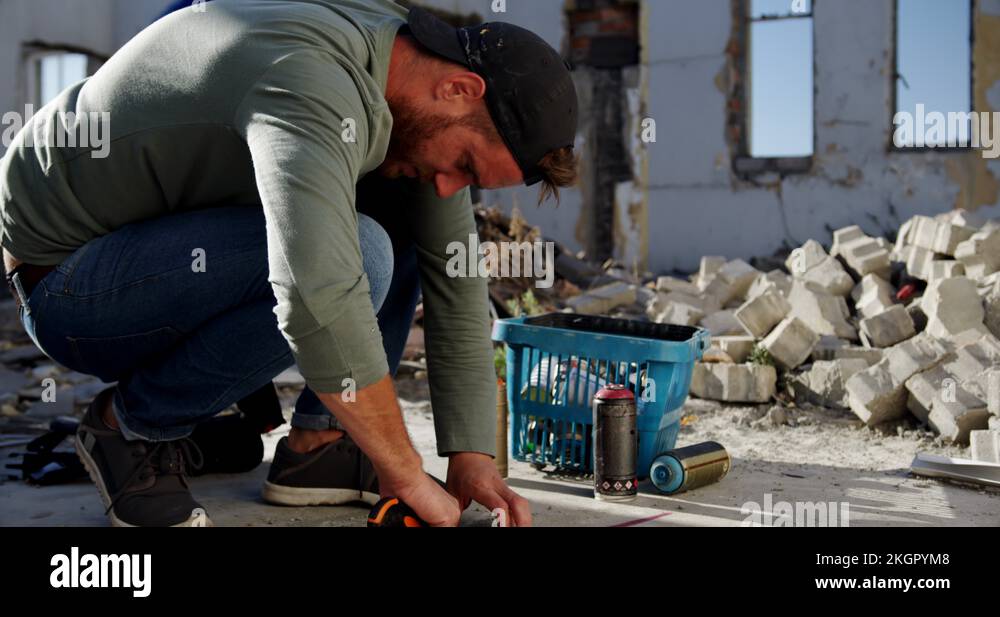 Graffiti artist cutting cardboard with cutter 4k Stock Video Footage ...