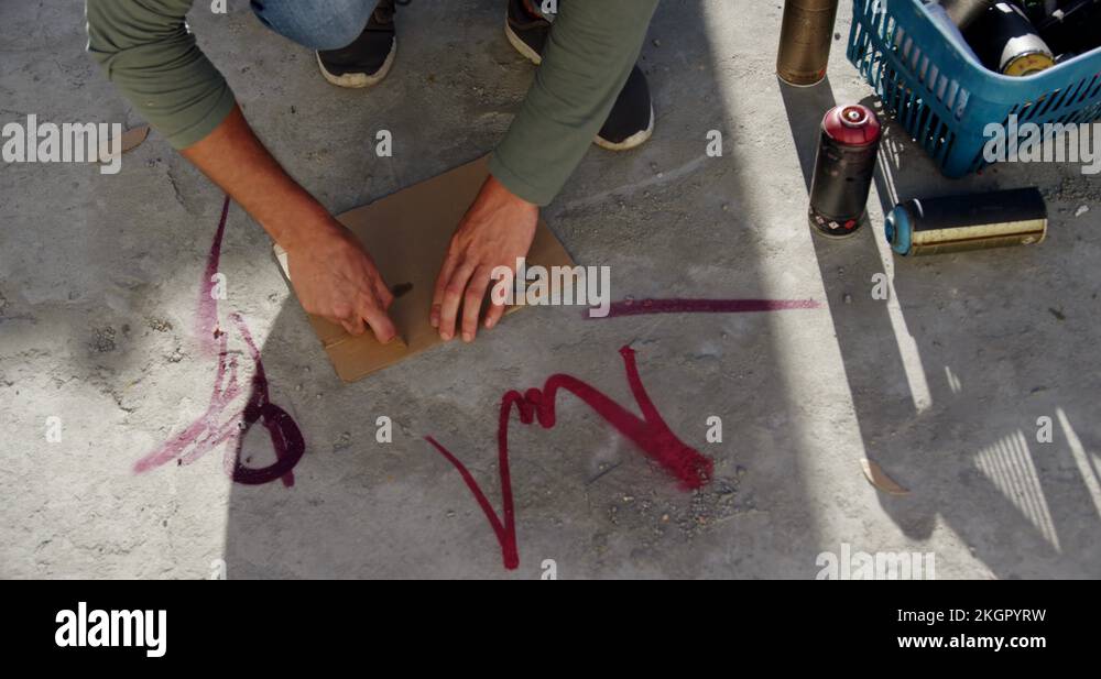 Graffiti artist cutting cardboard with cutter 4k Stock Video Footage ...