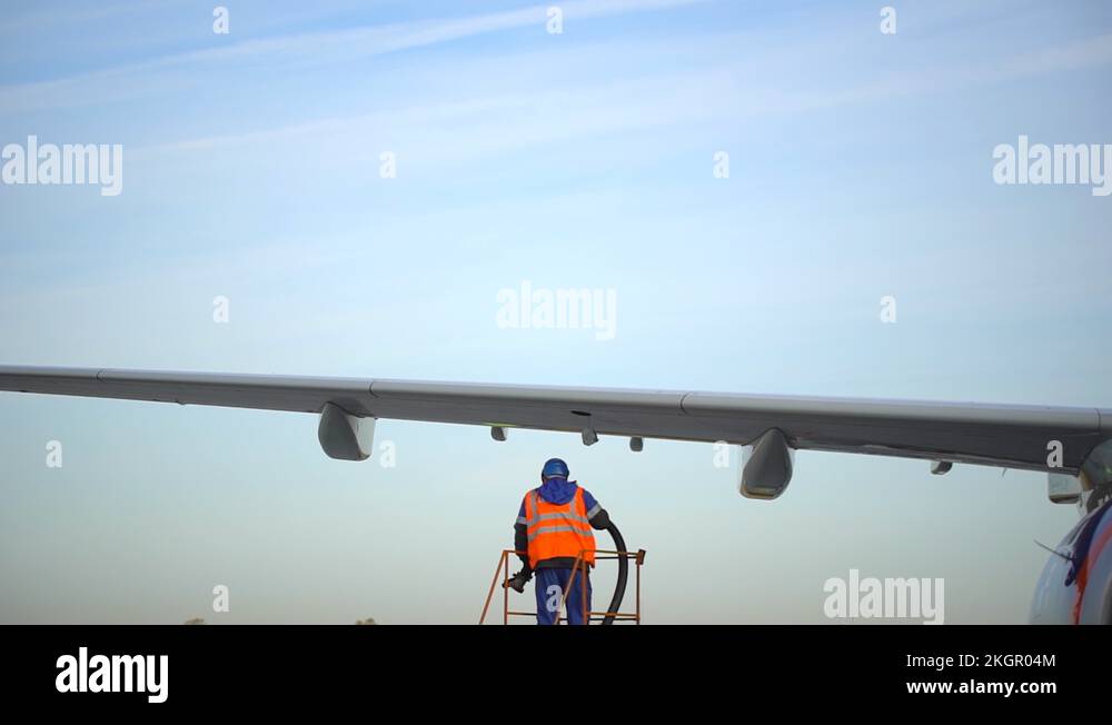 Airport airplane crew refueling aircraft on airline by technical staff ...