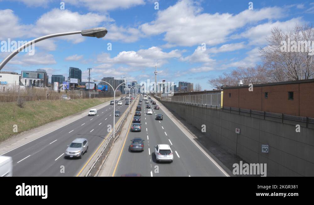 Gardiner Expressway with cars. View of Toronto, Canada in the distance ...