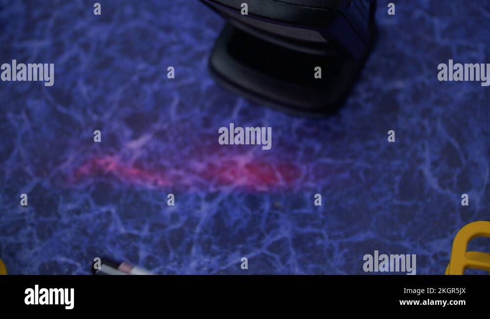 Female hand in blue rubber glove scanning barcode on the test tubes ...