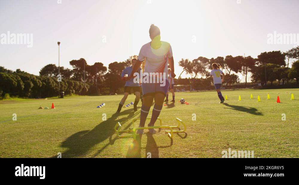 Female soccer team training on soccer field 4k Stock Video Footage - Alamy