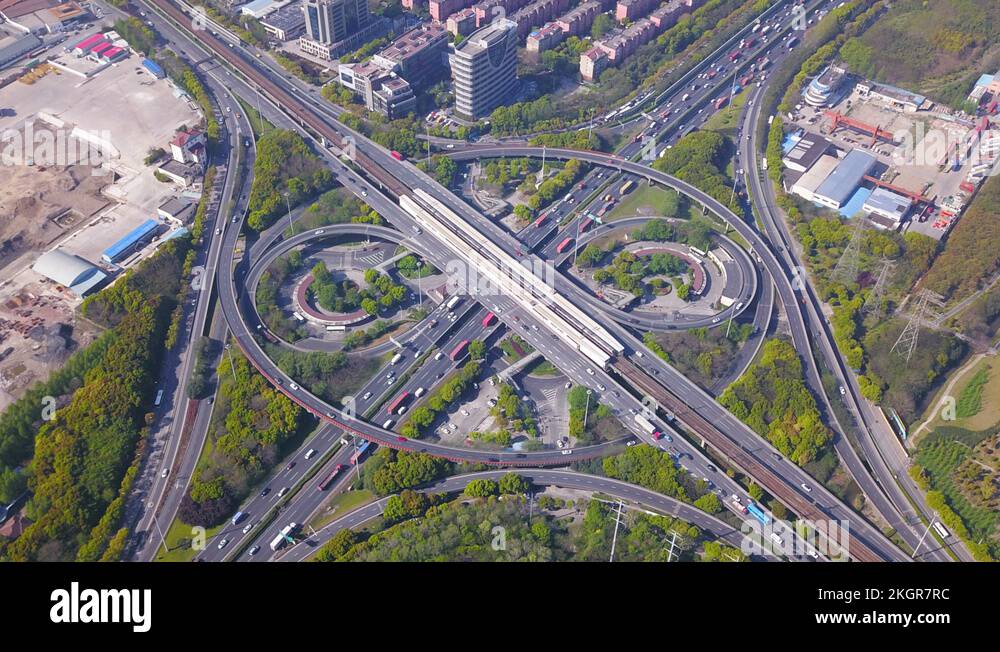 Time lapse of aerial view of highway junctions with roundabout. Bridge ...