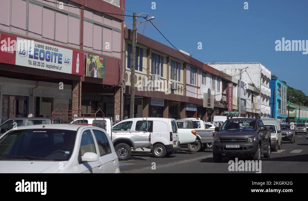 Cars and local people in main street of Uturoa, Raiatea, French ...