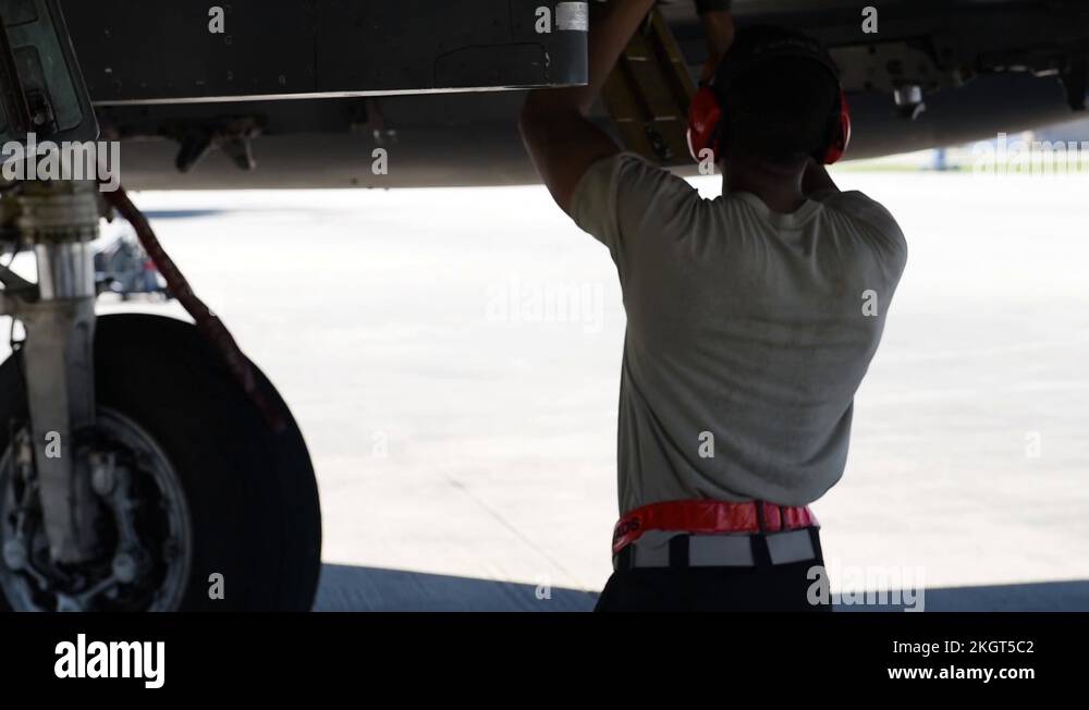 Aircraft maintainer taking fuel sample from F-15 Eagle Stock Video ...