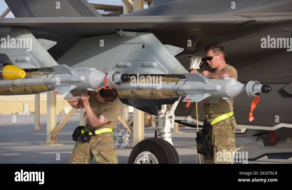 Airmen securing ordnance onto F-35A Lightning II at Al Dhafra Air Base ...