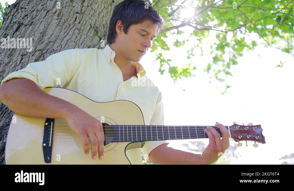 Man smiling playing guitar music Stock Videos & Footage - HD and 4K ...