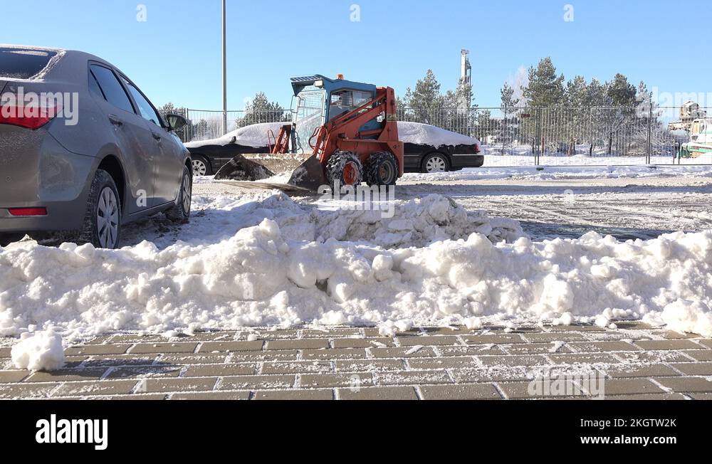 clearing sidewalk from snow after snowstorm at winter time. 4K Stock ...