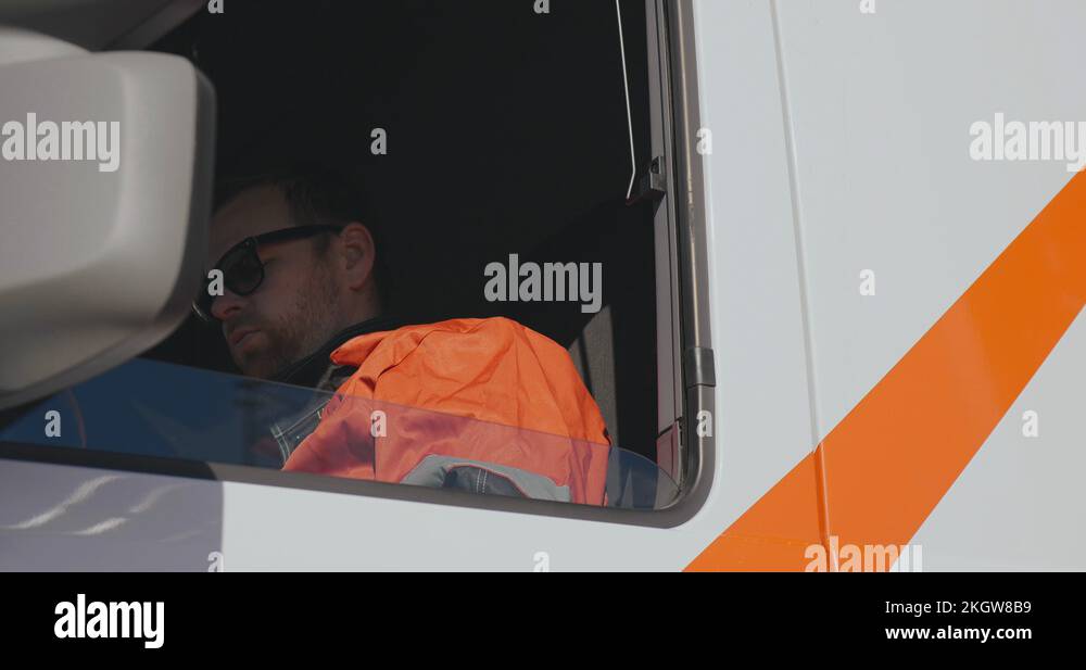 Two oil field workers make daily routine records in documents. Side ...