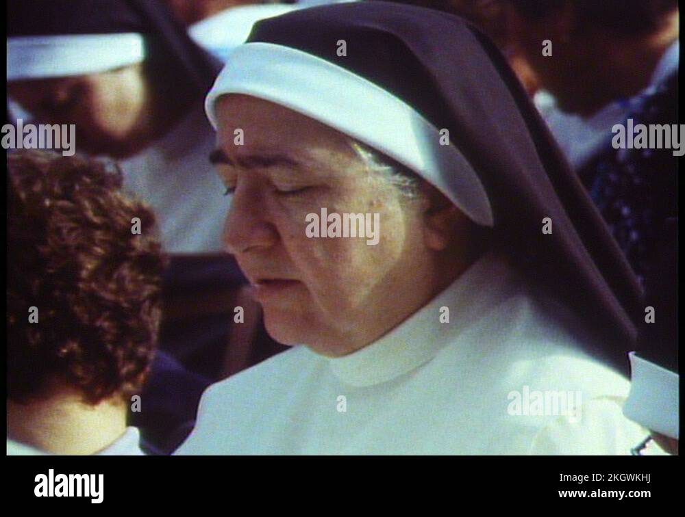 ROME, ITALY, 1988, The Vatican, Papal Mass, one nun, close up, praying ...