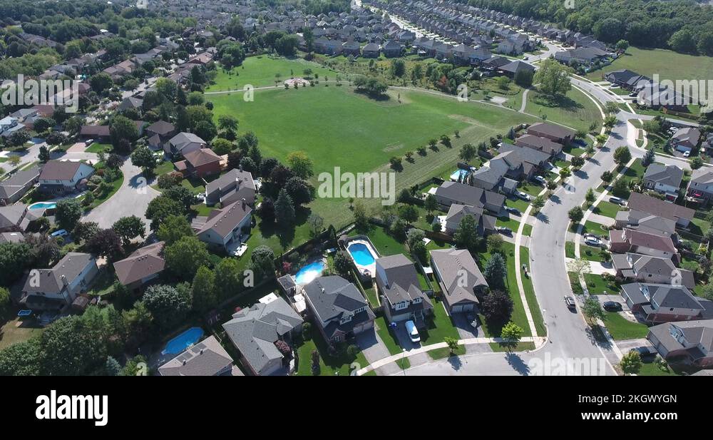 Aerial Flying Over Park Towards Rows Of Newly Constructed Houses With ...