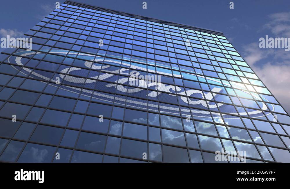 FORD logo on modern building reflecting sky and clouds, editorial ...