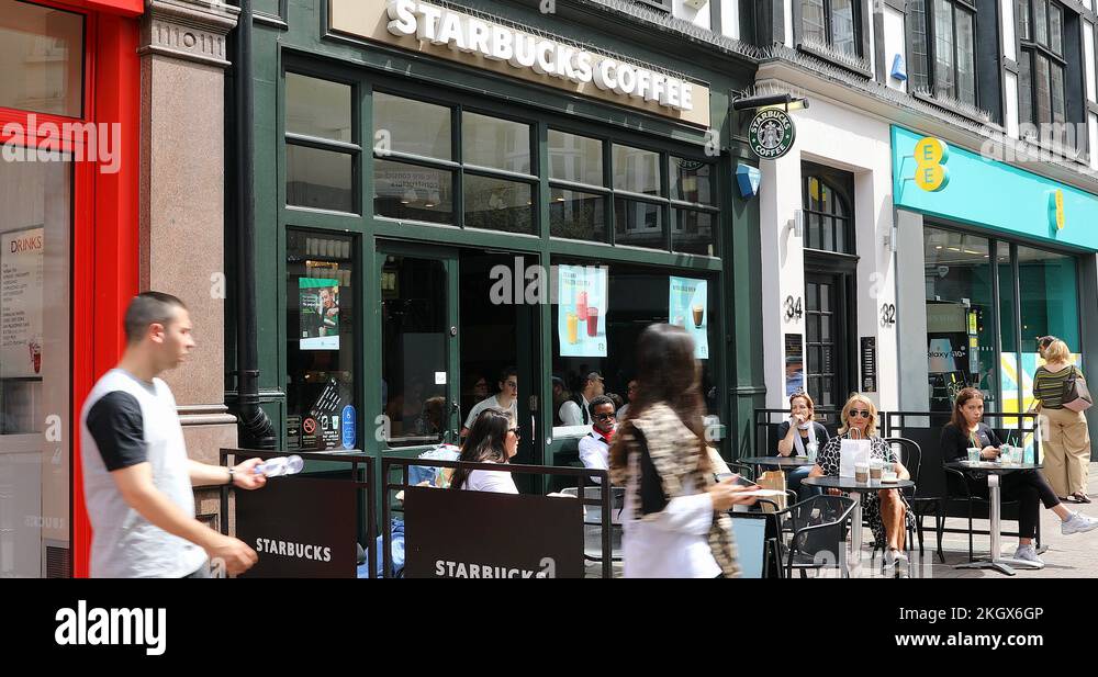 People Sitting On The Terrace Of Starbucks Coffee Stock Video Footage ...