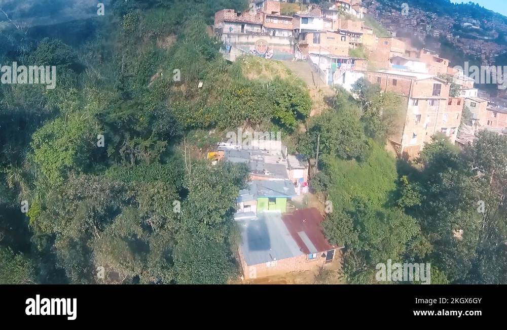 Slums of Medellin passing by seen from a cable car, colombian ghetto ...